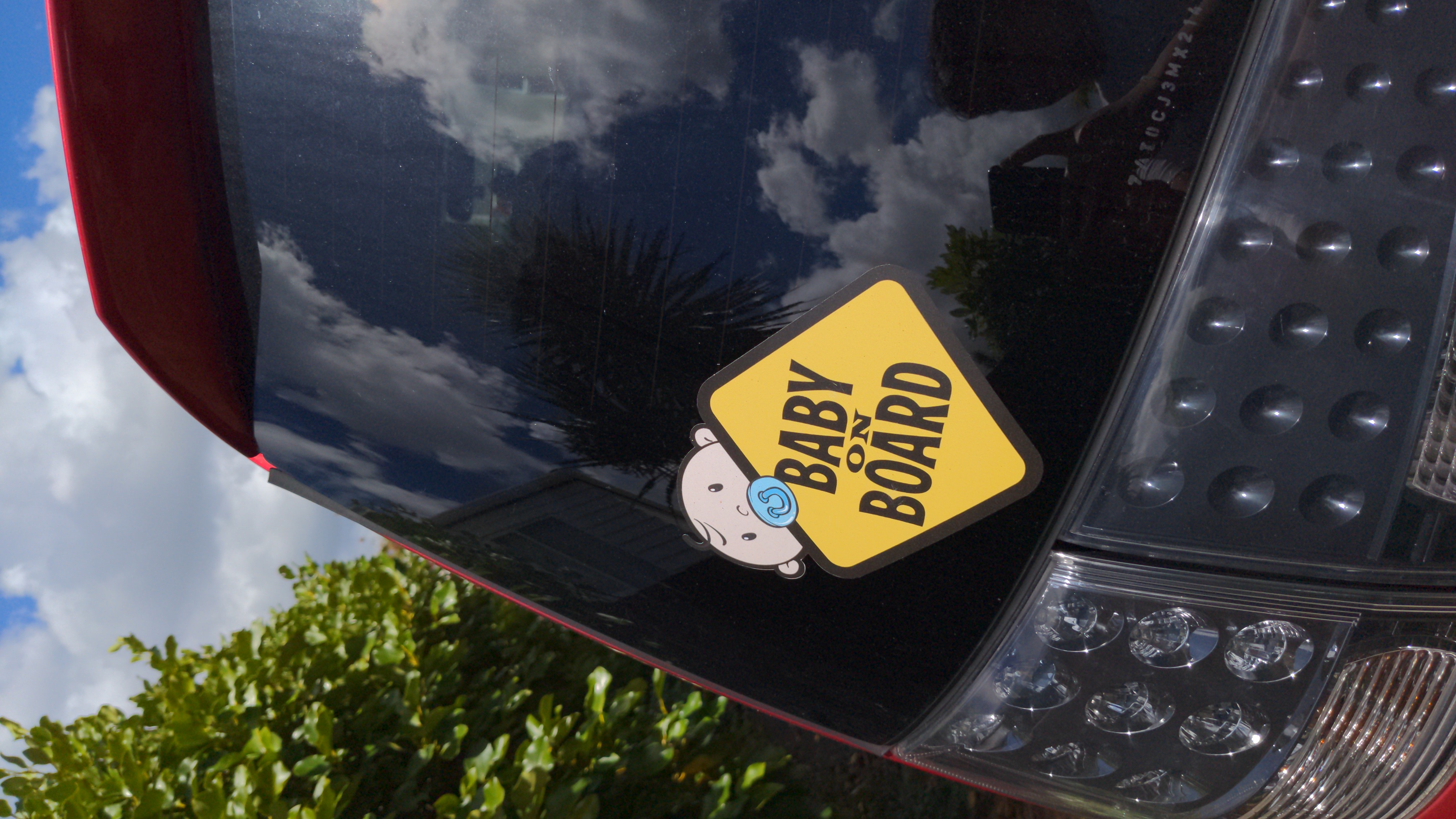 Yellow sign with cute baby on board sticker - TenStickers