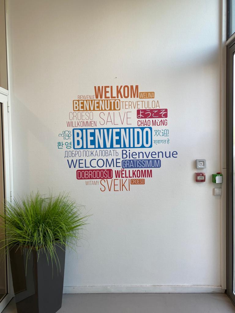 Welcome word cloud in many languages office text sticker - TenStickers