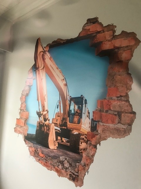 Damaged wall featuring three excavators 3D wall sticker