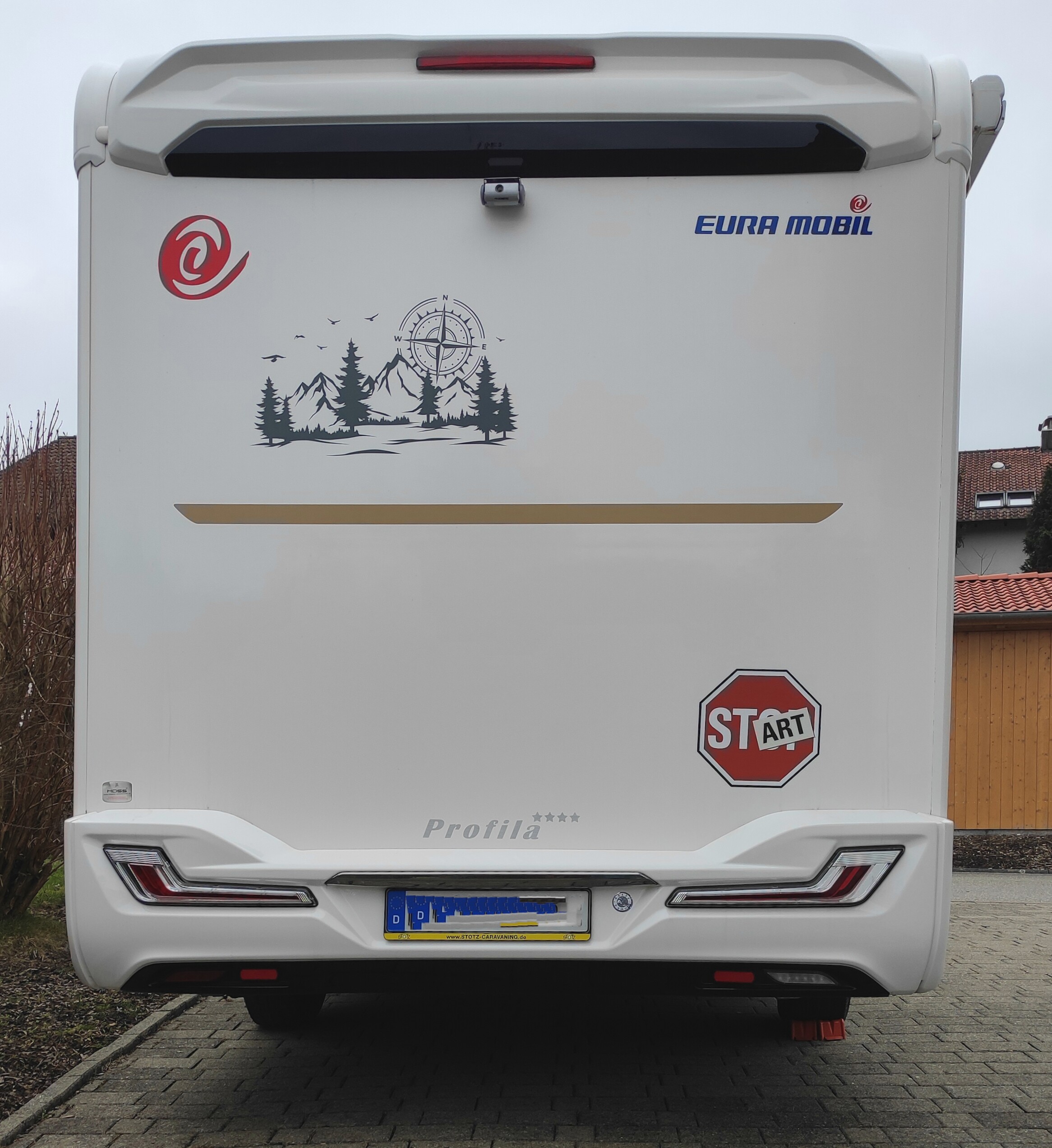 mountainous landscape and compass caravan decals